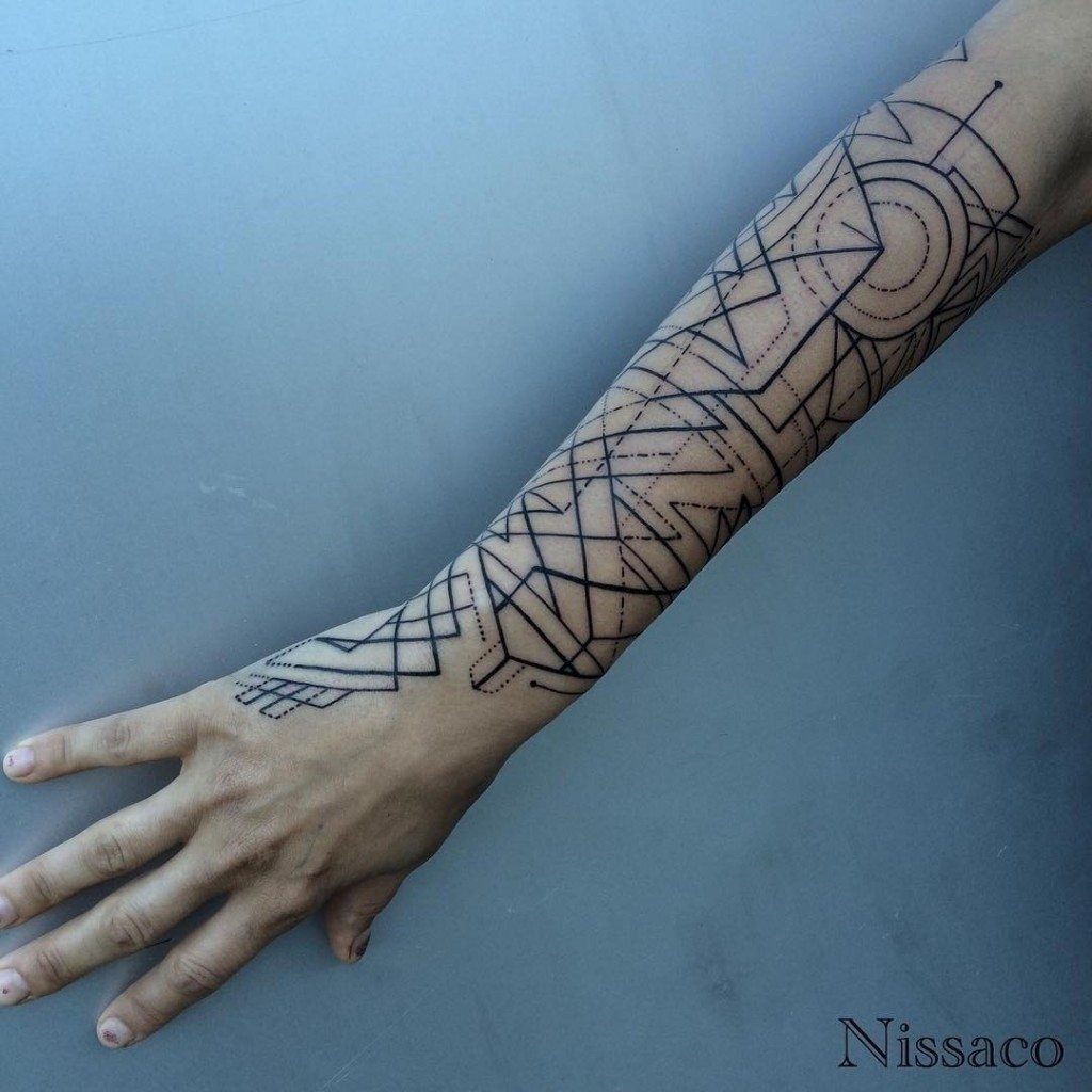 Nissaco's tattoo work rides the crosshairs of optical illusion and reality